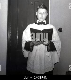 1950s, historical, choir boy, wearing traditional cassock or tunic over ...