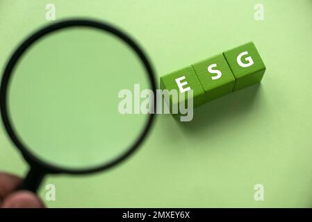 ESG Environment Social Governance. Magnifying glass on office desk ...