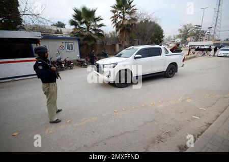 PESHAWAR PAKISTAN, JANURAY, 01: A policeman searches a man at the entry ...