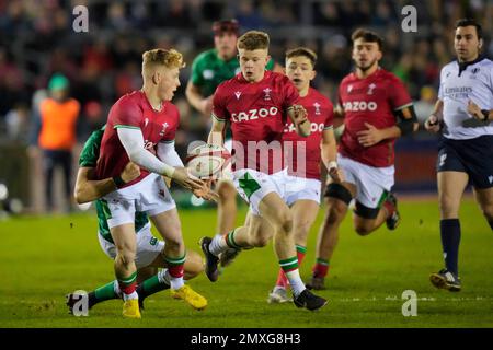 Harri Houston #11 of Wales offloads to Archie Hughes during the 2023 ...