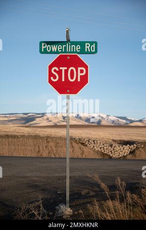 The Powerline Road with stop signal Stock Photo - Alamy