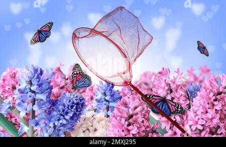 Bright net and fragile monarch butterflies in flower garden Stock Photo ...