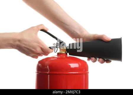 Woman using fire extinguisher on white background, closeup Stock Photo ...