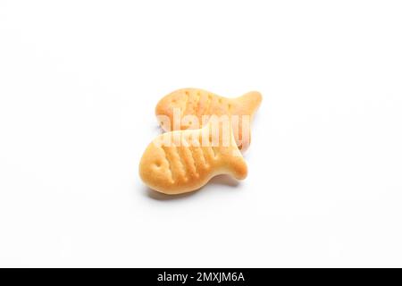 Delicious crispy goldfish crackers on white background, top view Stock ...