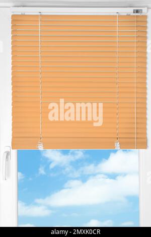 pattern of orange shutter sun protection at a facade of a modern ...