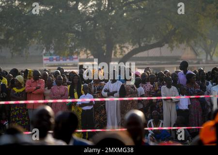 People stand in the streets in Juba, South Sudan, before Pope Francis' convoy passes on its way ...