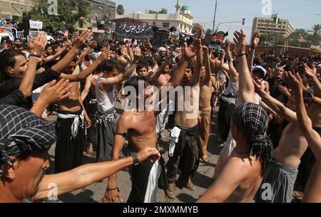 Shia Muslims beat their chests during an Ashura procession on Boats in ...