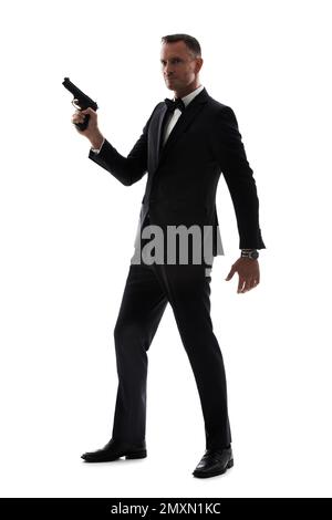 man in a suit with a gun in hand Studio emotions Stock Photo - Alamy