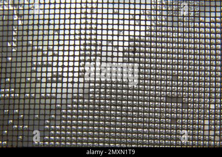 wet protective mesh for conditioning with water drops, macro Stock ...