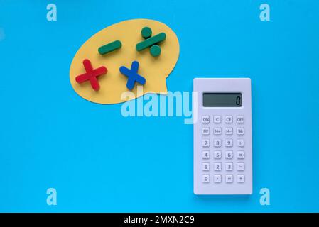 Colorful mathematical shape (Plus, minus, multiply, divide) on blue ...