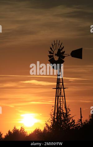 Kansas Sunset with a Windmill silhouette Stock Photo - Alamy
