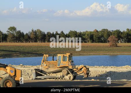 A caterpillar Bull Dozer at a work site with blue sky Stock Photo - Alamy