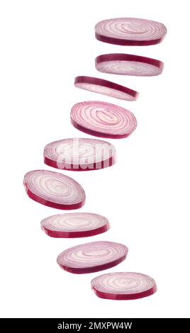 Red onion slices falling on white background Stock Photo - Alamy