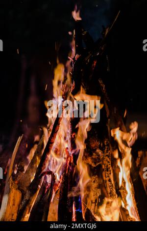 A vertical shot of a big bonfire at night Stock Photo - Alamy