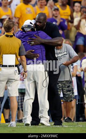 Former LSU head football coach, Ed Orgeron, right, talks to his girlfriend Bailie Lauderdale ...