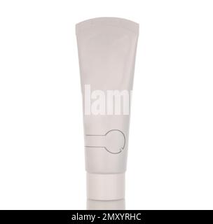 Container with dental floss, toothpaste and toothbrush on light blue ...