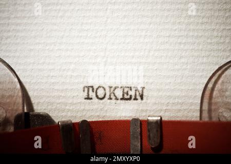 Token word written with a typewriter Stock Photo - Alamy