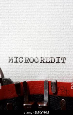 Microcredit word written with a typewriter Stock Photo - Alamy