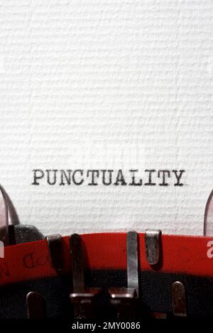 Punctuality word written with a typewriter Stock Photo - Alamy