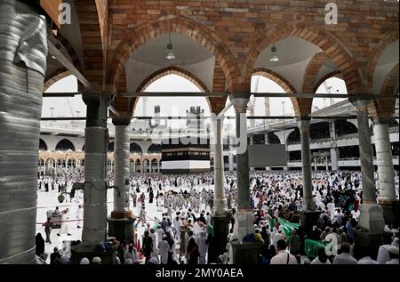 Muslim pilgrims circle the Kaaba, Islam's holiest shrine, at the Grand ...