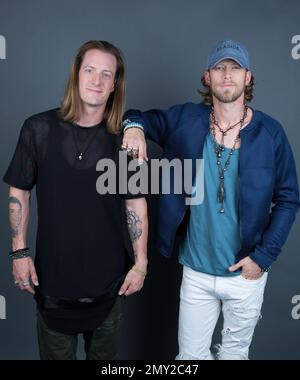 Brian Kelley, left, and Tyler Hubbard arrive at the Billboard Music ...