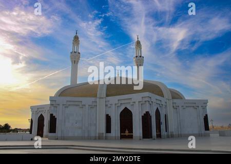 Beautiful front view of the entrance of Hassan En any Mosque at sunset ...
