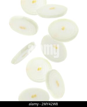 Fresh onion slices falling on white background Stock Photo - Alamy