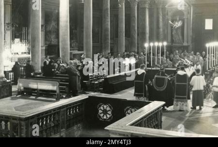 Traditional Italian catholic church funeral with wagon, procession and ...
