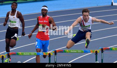 Puerto Rico's Javier Culson, center, Belgium's Michael Bultheel, left ...