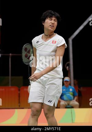Hong Kong's Yip Pui Yin returns a shot to China's Zhang Ning during ...