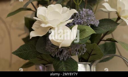 This is footage of White Roses indoors sat on a fire place Stock Photo ...