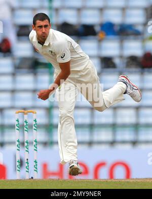 Mitchell Starc of Australia delivers the first ball of the innings ...