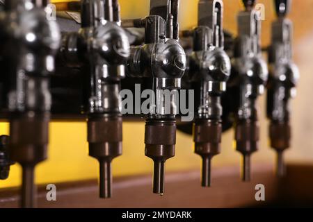 New modern beer taps in pub, closeup. Professional bar equipment Stock ...