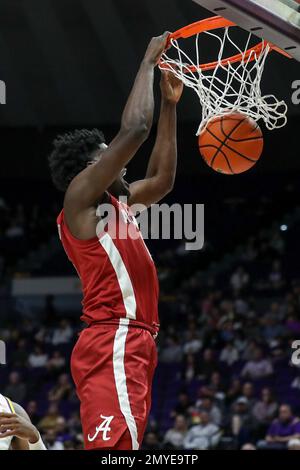 Alabama center Charles Bediako (14) slam dunks the ball during the ...