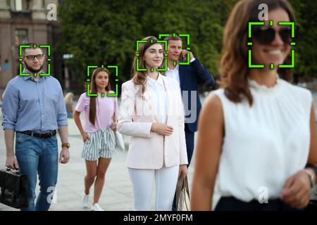 Facial recognition system identifying people on city street Stock Photo ...