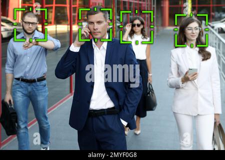 Facial recognition system identifying people on city street Stock Photo ...