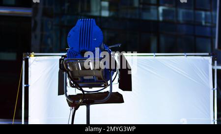 High powered spotlight illuminating an outdoor movie set Stock Photo ...