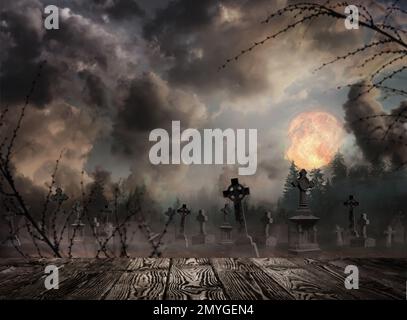 Wooden surface and misty graveyard with old creepy headstones under ...