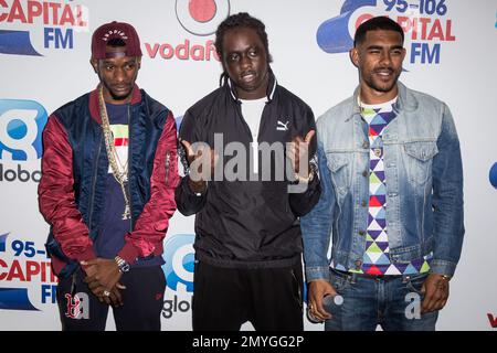 Akelle Charles, Haile Rei and Louis Rei of WSTRN pose for photographers ...
