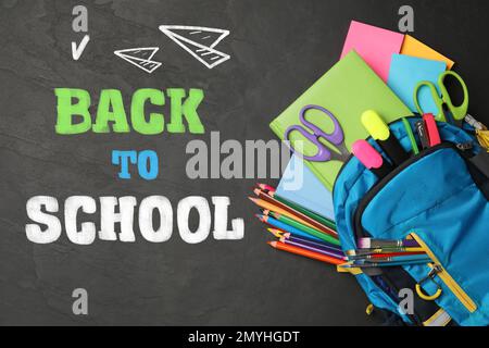 Backpack with different colorful stationery on blue background. 3d ...