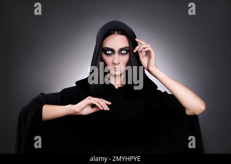 Mysterious witch with spooky eyes on white background, closeup Stock ...