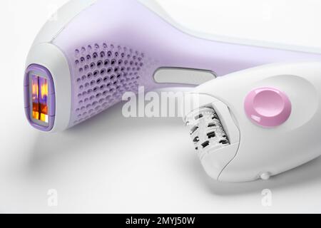 Modern devices for epilation on white background Stock Photo - Alamy