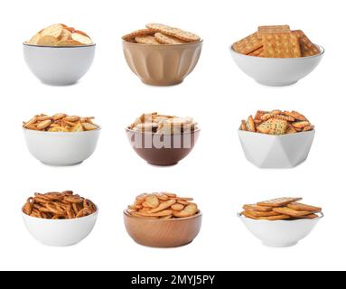 Bowls with tasty different crackers on wooden background Stock Photo ...