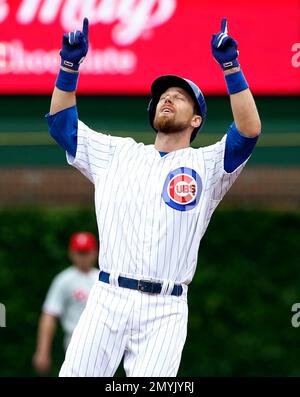 The Chicago Cubs' Ben Zobrist celebrates with the MVP trophy after his ...
