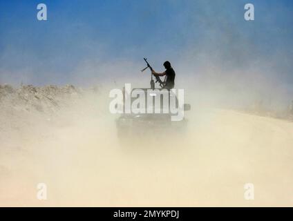 Fighters with Badr Brigades an armed Shiite group under the umbrella of ...