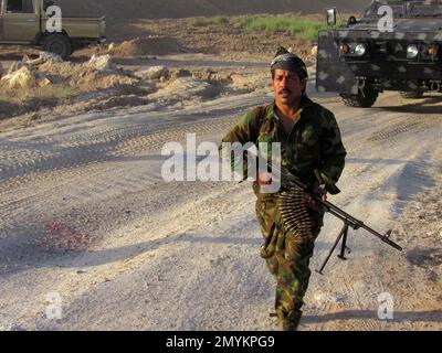 Fighters with Badr Brigades an armed Shiite group under the umbrella of ...
