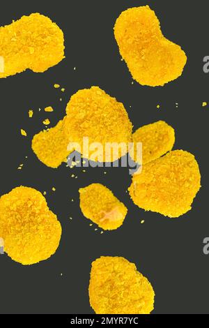 Falling chicken nuggets isolated on a white background, clipping path ...
