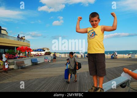 funny boy child shows his muscles Stock Photo - Alamy