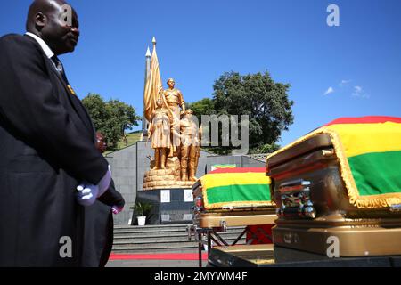 Pallbearers stand next to the coffins of government ministers who died ...
