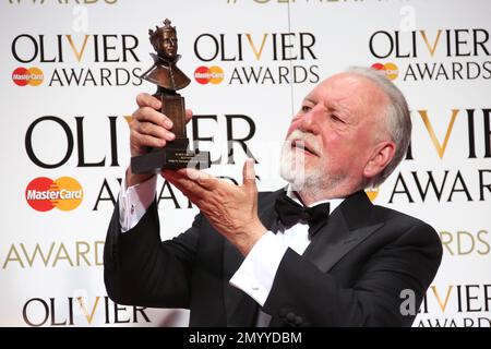 Actor Kenneth Cranham holds his Best Actor award for his performance in ...